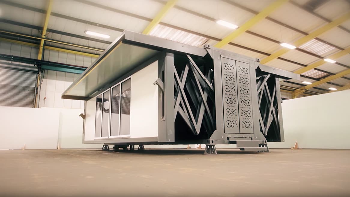 This folding multi functional unit fits inside a shipping container